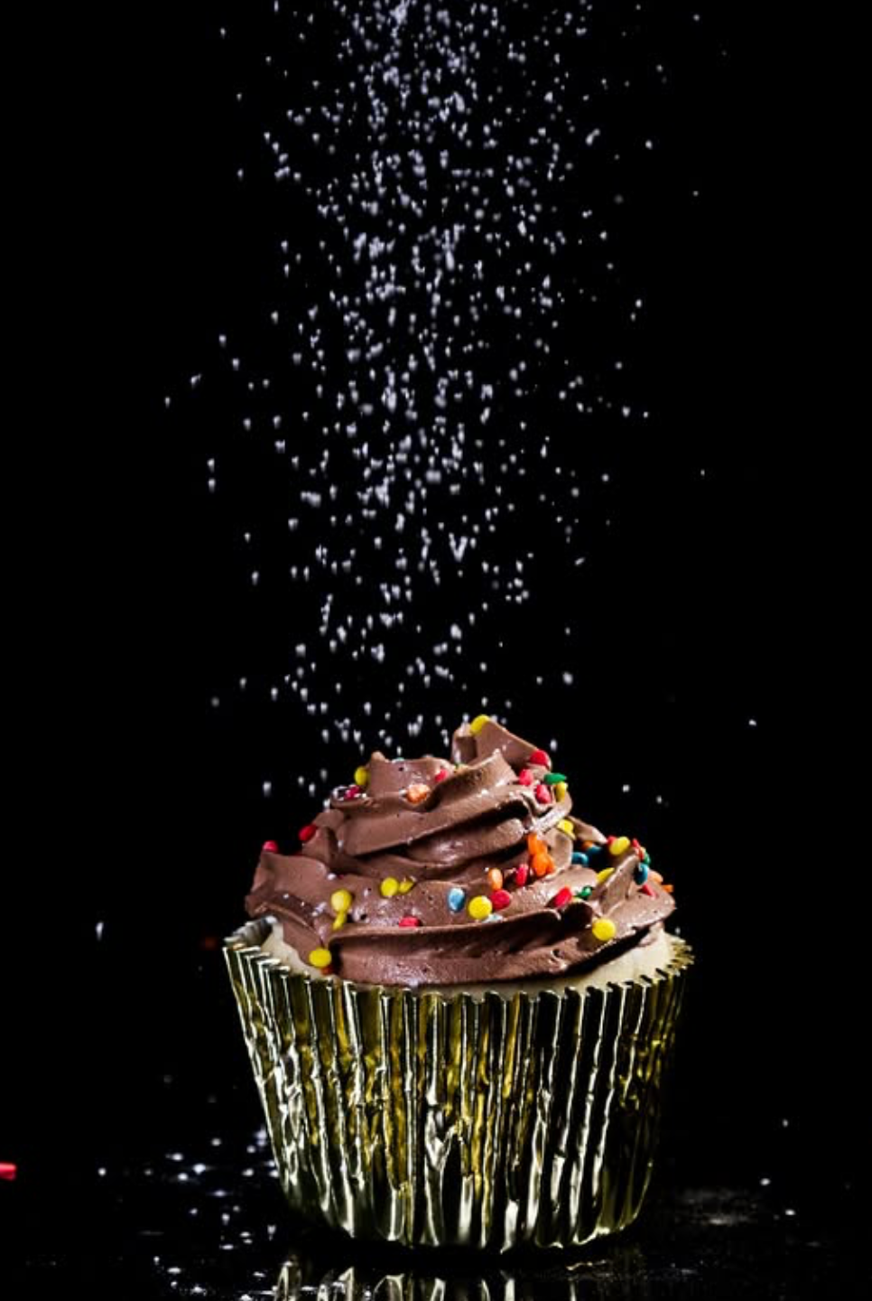Edible Gold scattered over a chocolate cupcake 🧁– Edible Gold Leaf